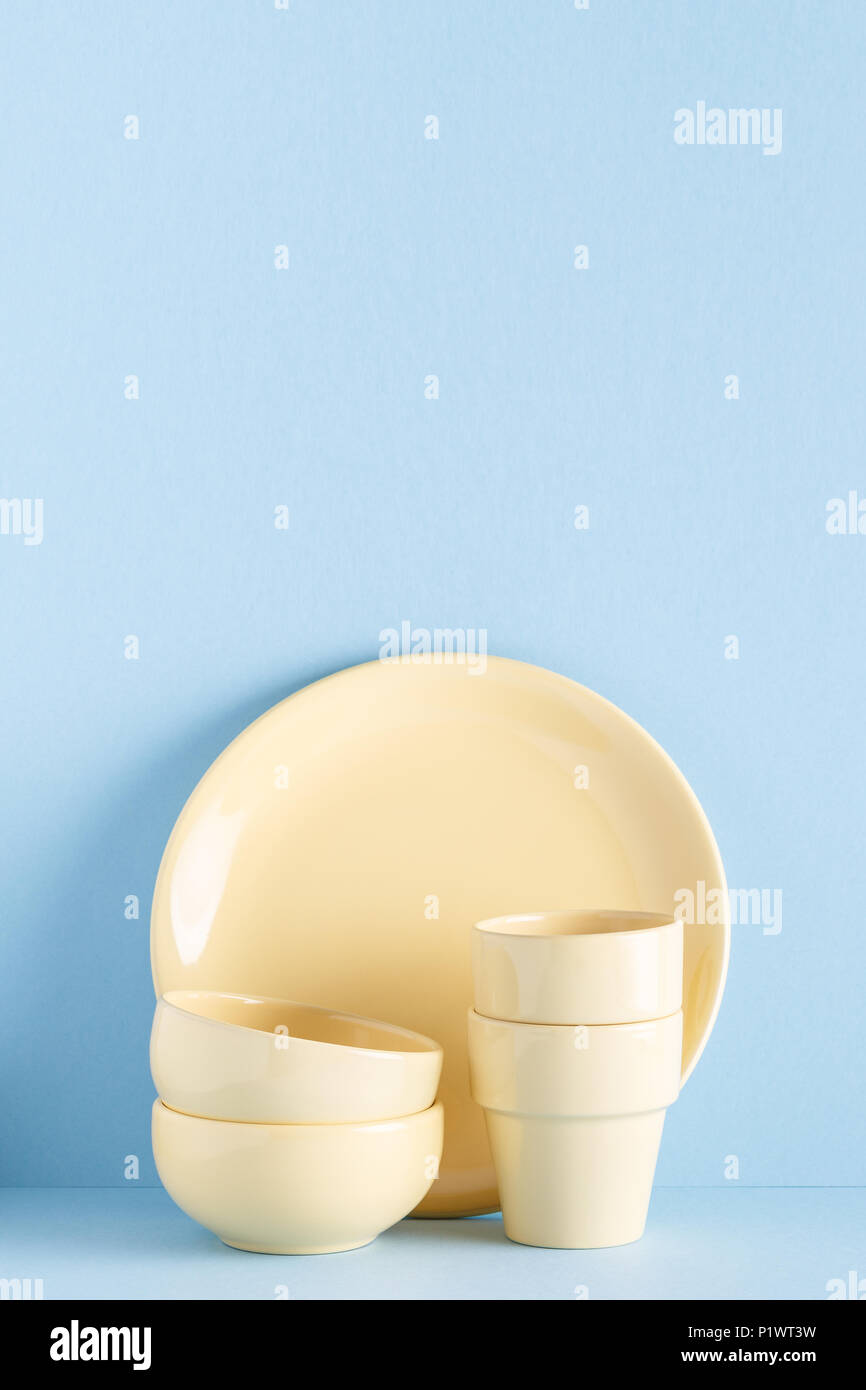 Crockery and cutlery on a blue pastel background with copy space Stock ...