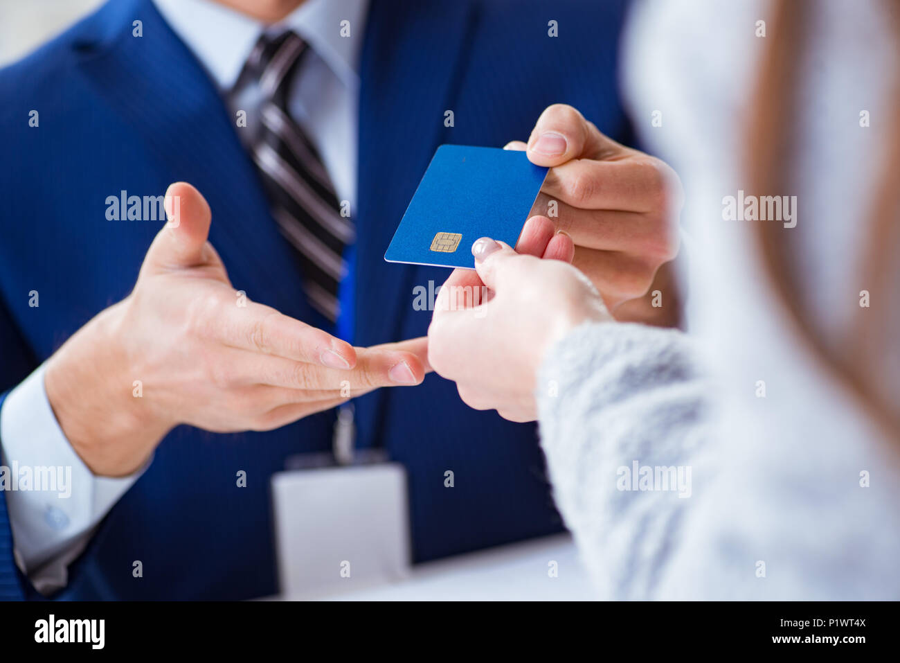 Woman makes payment with credit card Stock Photo - Alamy