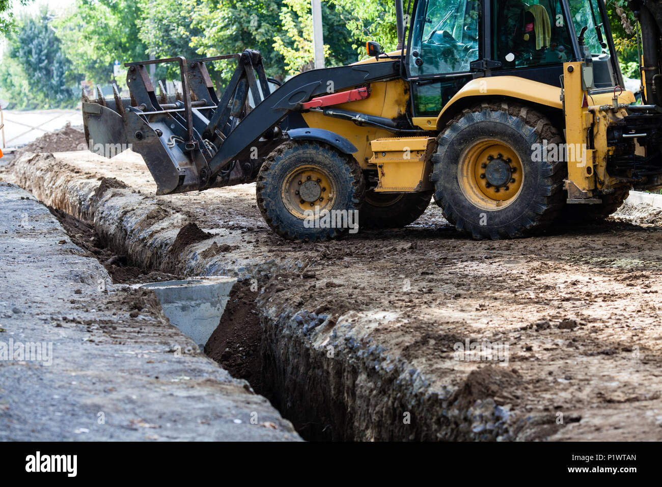 Excavator while working Stock Photo - Alamy