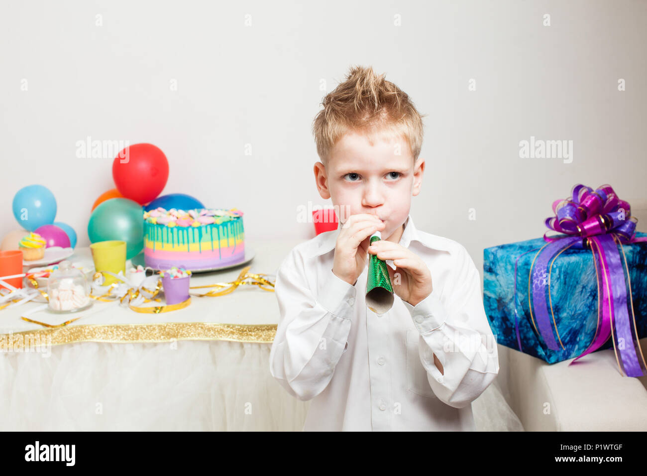 lovely boy is celebraiting birthday party Stock Photo - Alamy