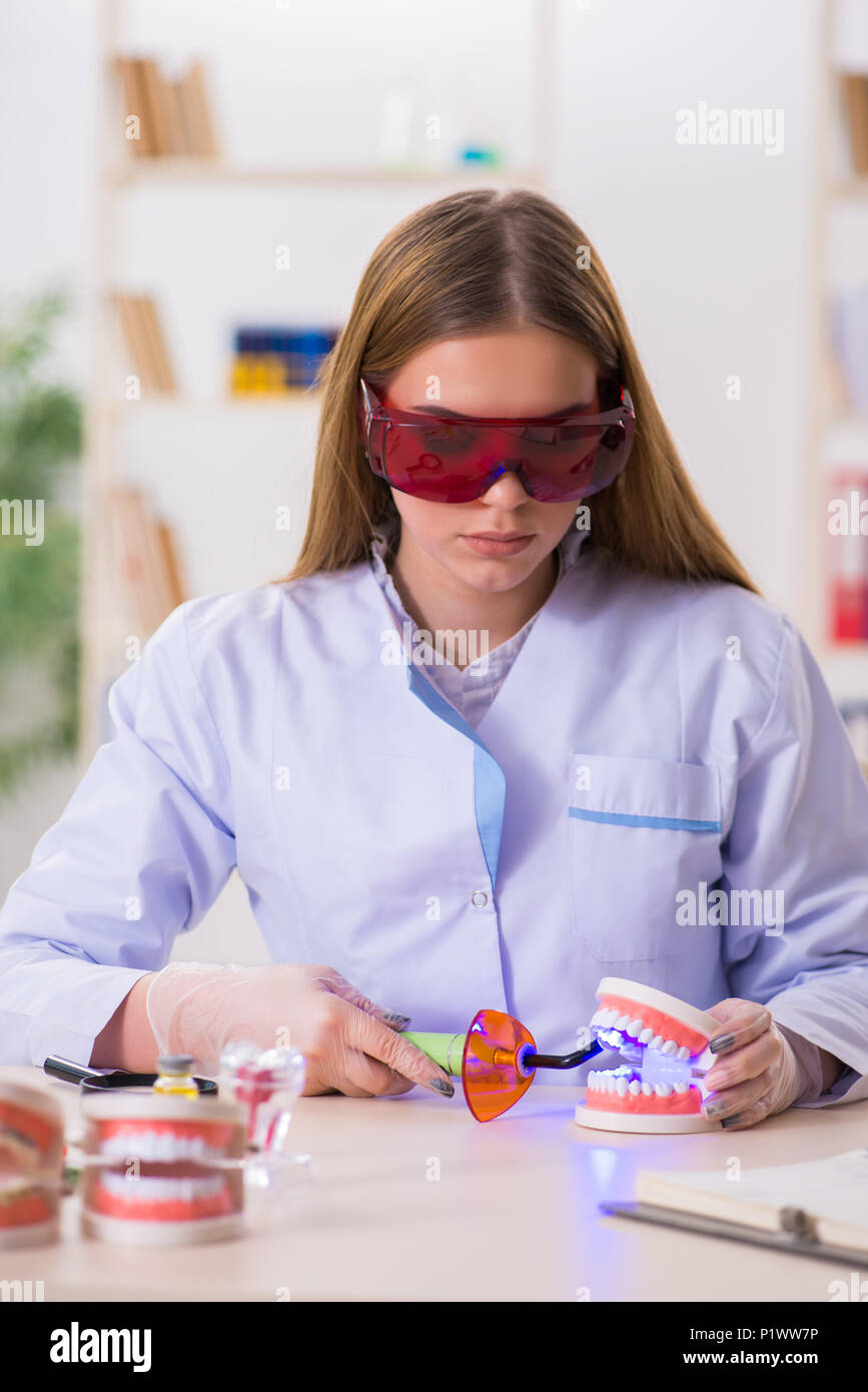 Dentistry student practicing skills in classroom Stock Photo - Alamy