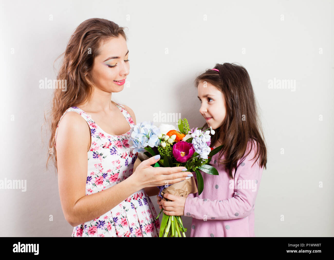 Baby girl giving flower hi-res stock photography and images - Alamy