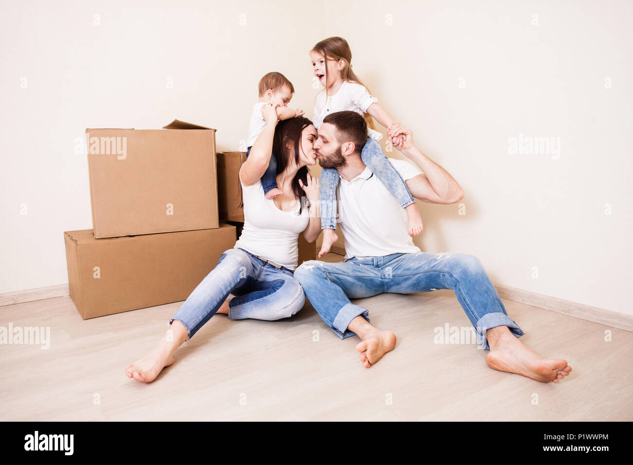 Family with kids and moving Stock Photo - Alamy