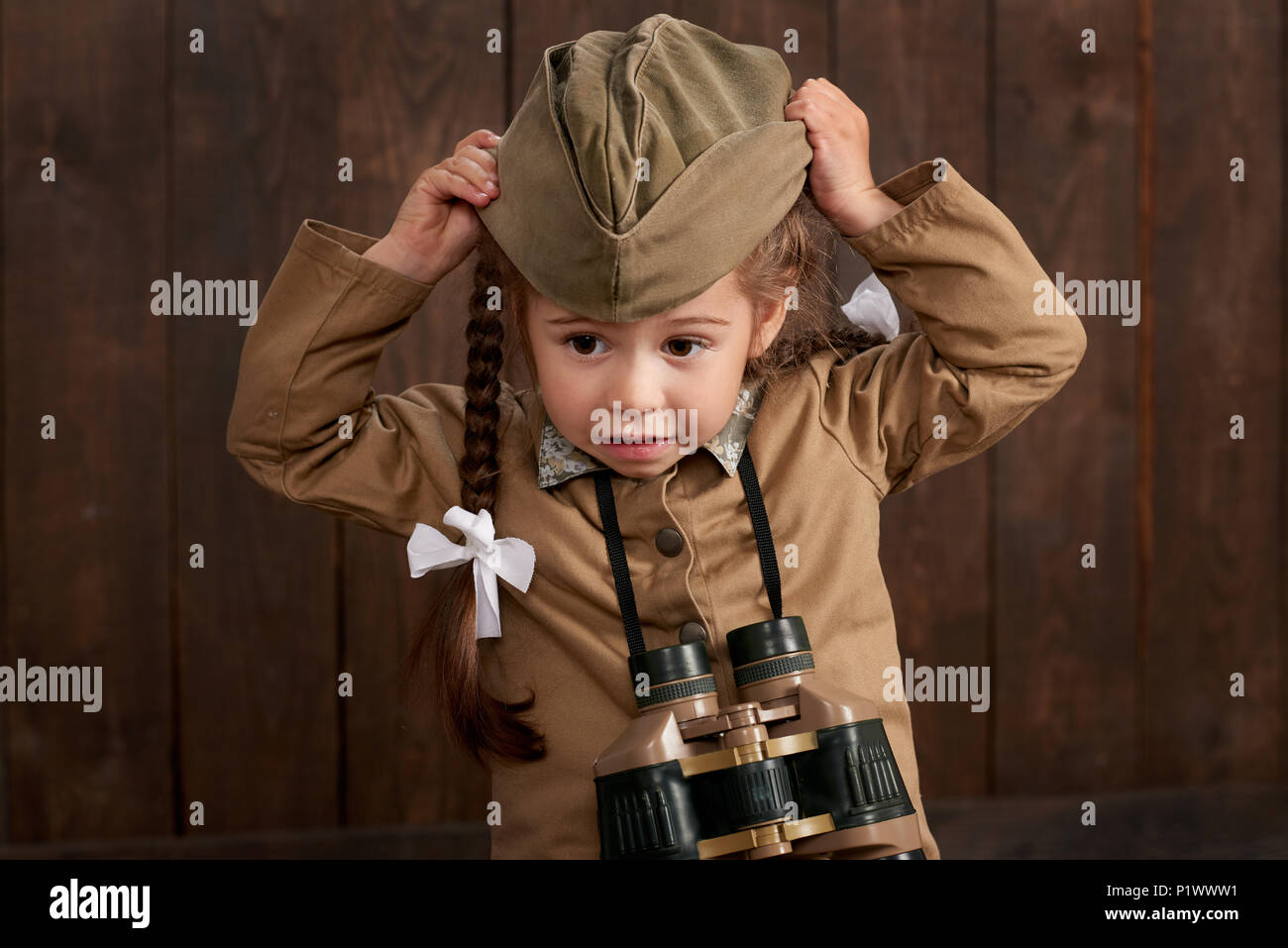 child girl are dressed as soldier in retro military uniforms Stock ...