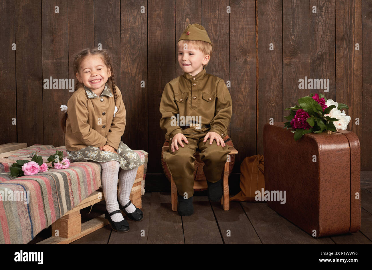children are dressed in retro military uniforms sending a soldier to ...