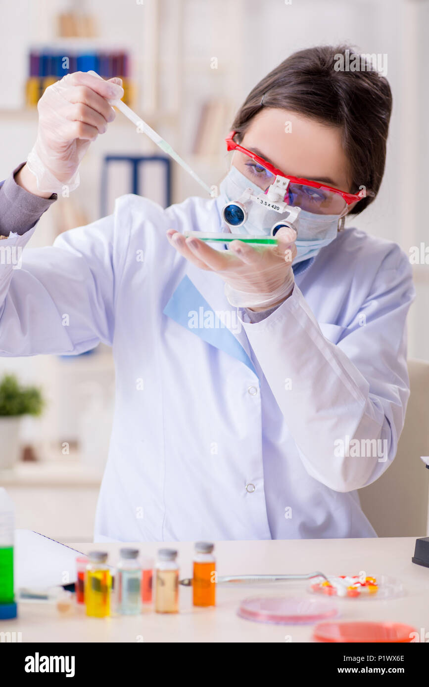 Lab assistant in drug synthesis concept Stock Photo - Alamy