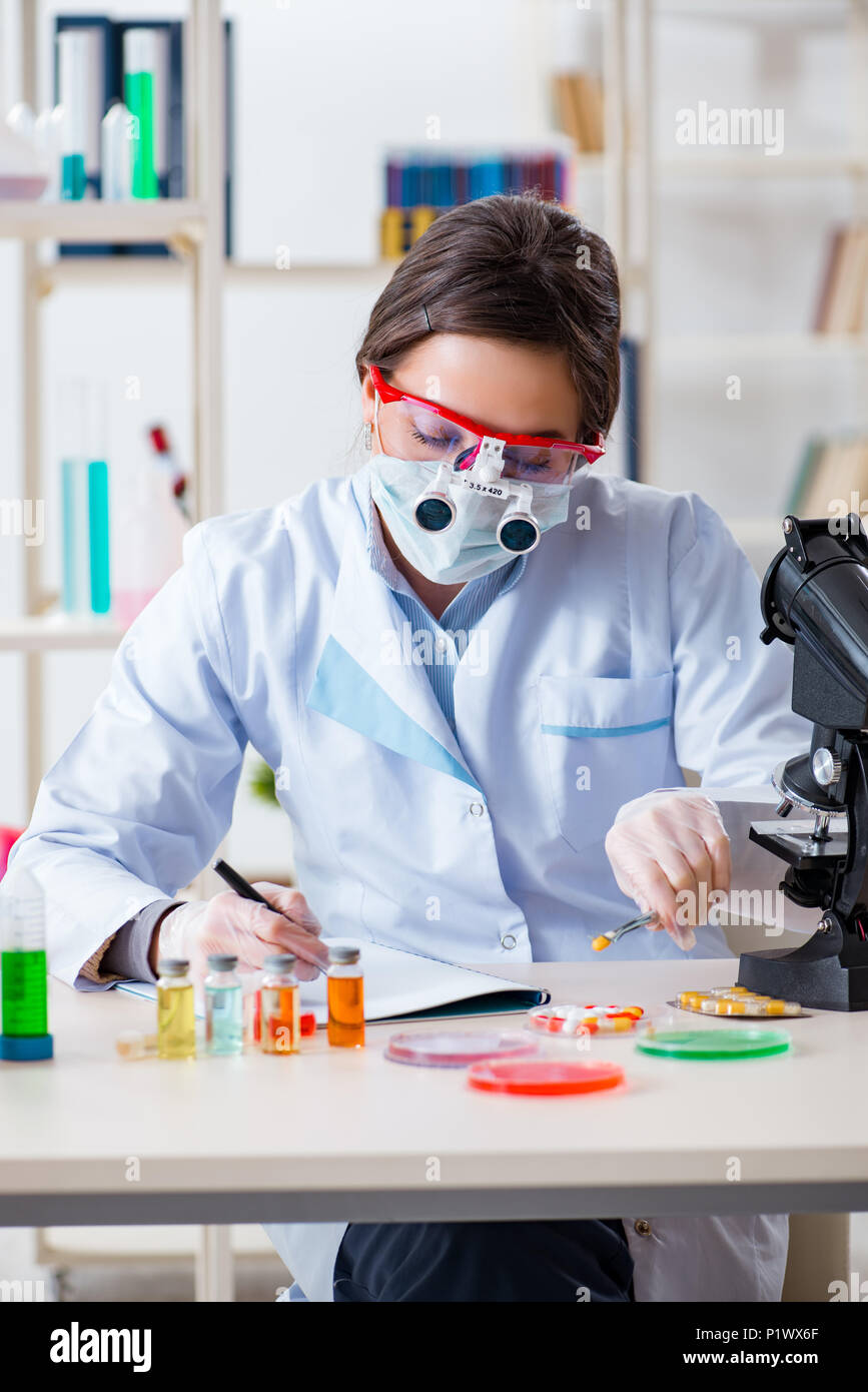 Lab assistant in drug synthesis concept Stock Photo - Alamy