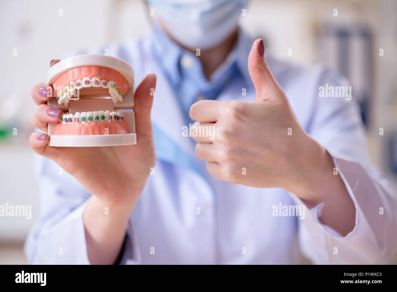 Dentist practicing work on tooth model Stock Photo - Alamy
