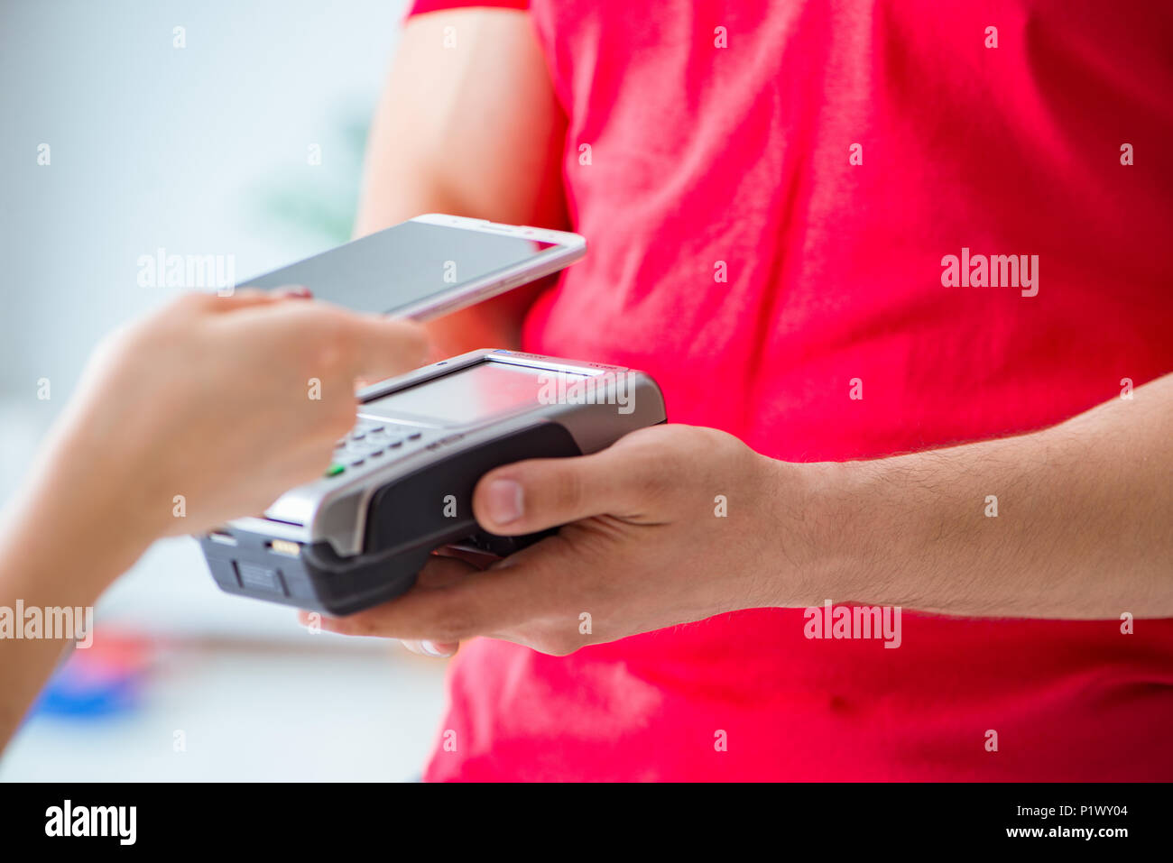 Concept of paying with POS terminal Stock Photo - Alamy