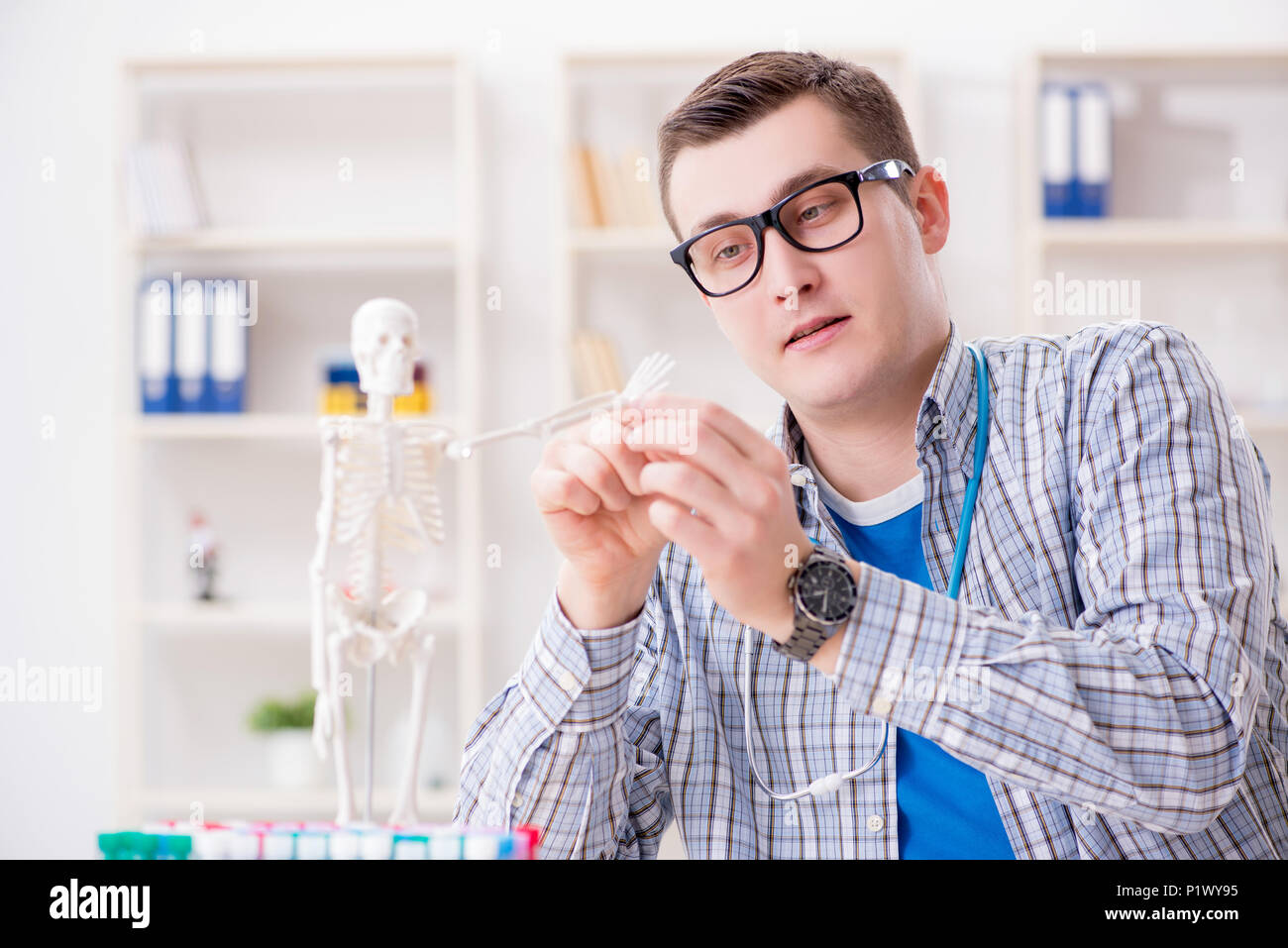 Medical student studying skeleton in classroom during lecture Stock ...