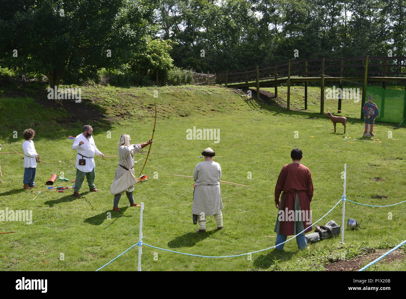 Archery demonstration at Flag Fen Archaeology Park. Anglo-Saxon Re ...