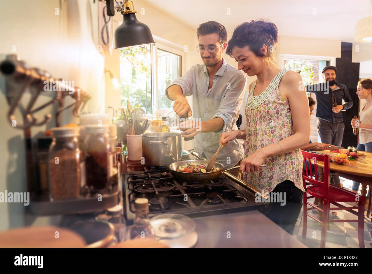 Male friends kitchen vegetables hi-res stock photography and images - Alamy