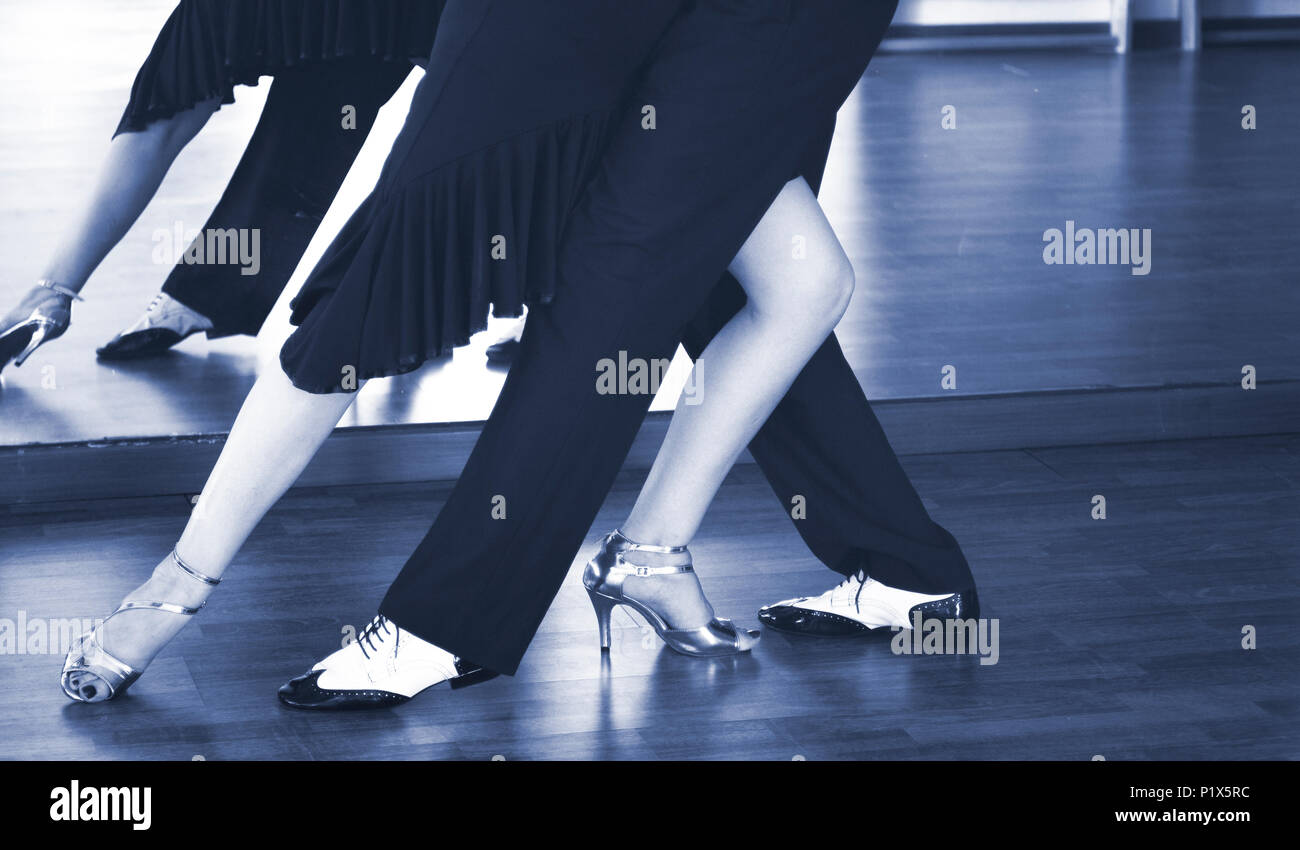 Ballroom dance couple of dancers and teachers in studio school dancing ...