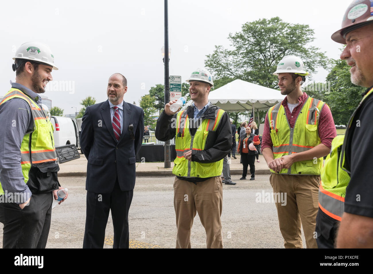 Attendees at the groundbreaking ceremony for the redevelopment of Cook ...