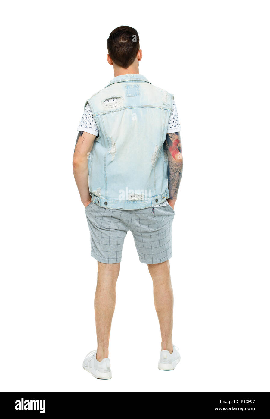 Back view of a stylish man in shorts. Rear view people collection ...