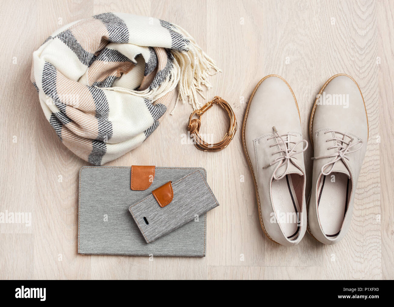 women's flat lay clothes shoes, scarf, bracelet, tablet, smartlphone ...