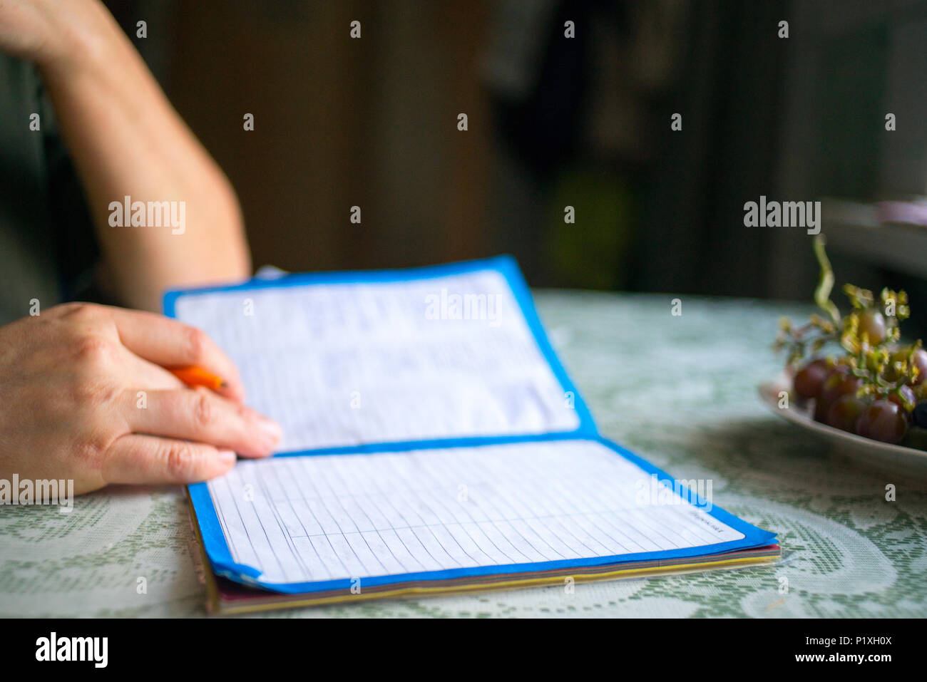 Human hand on notebook hi-res stock photography and images - Alamy