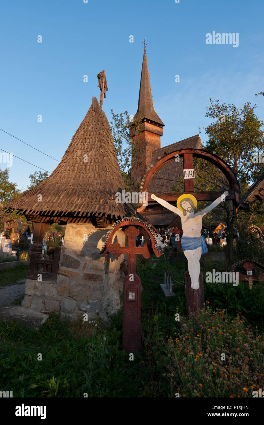 Orthodox cemetery with wooden Church in Maramures county, Romania Stock ...