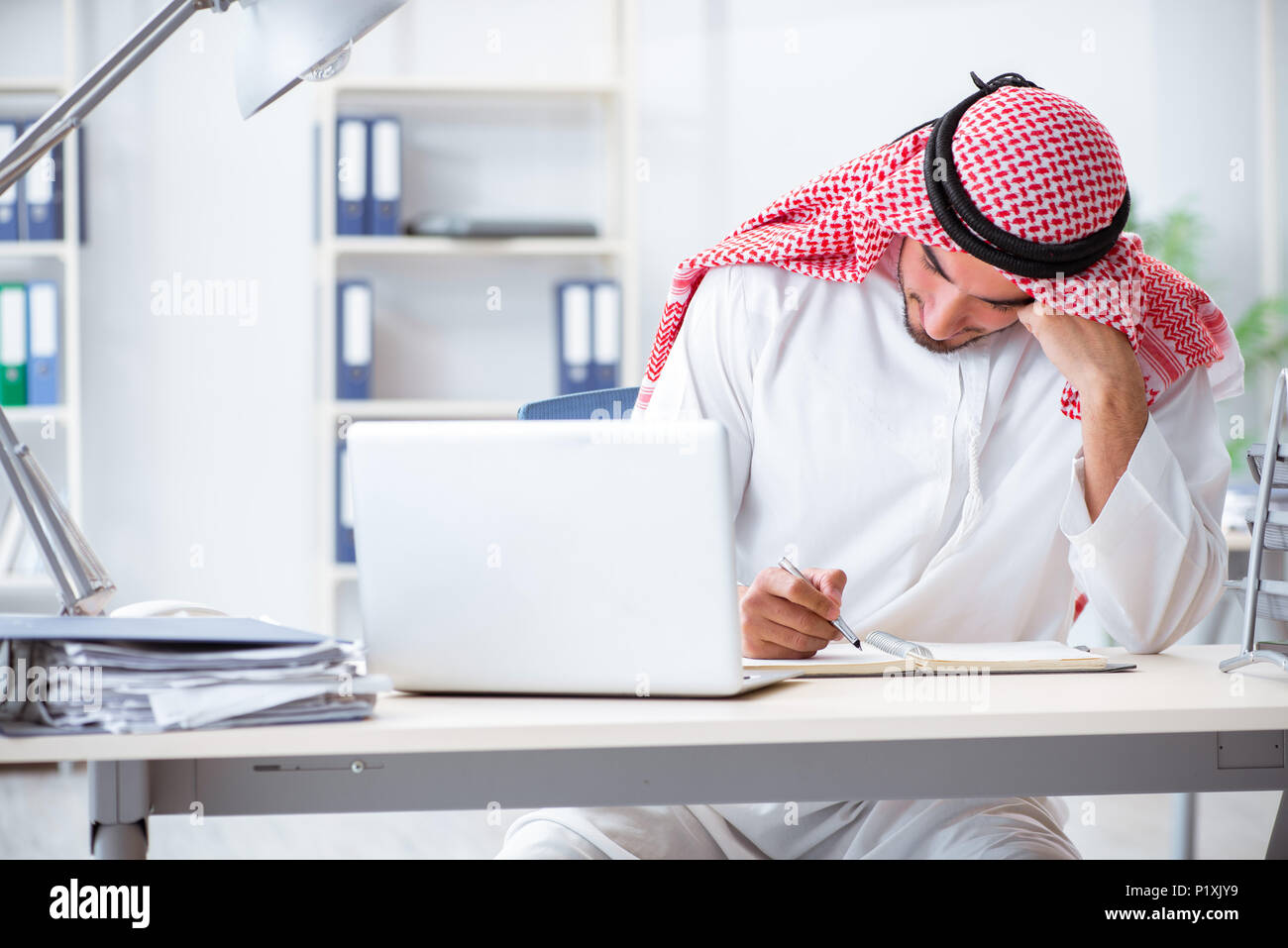 Arab businessman working in the office Stock Photo - Alamy