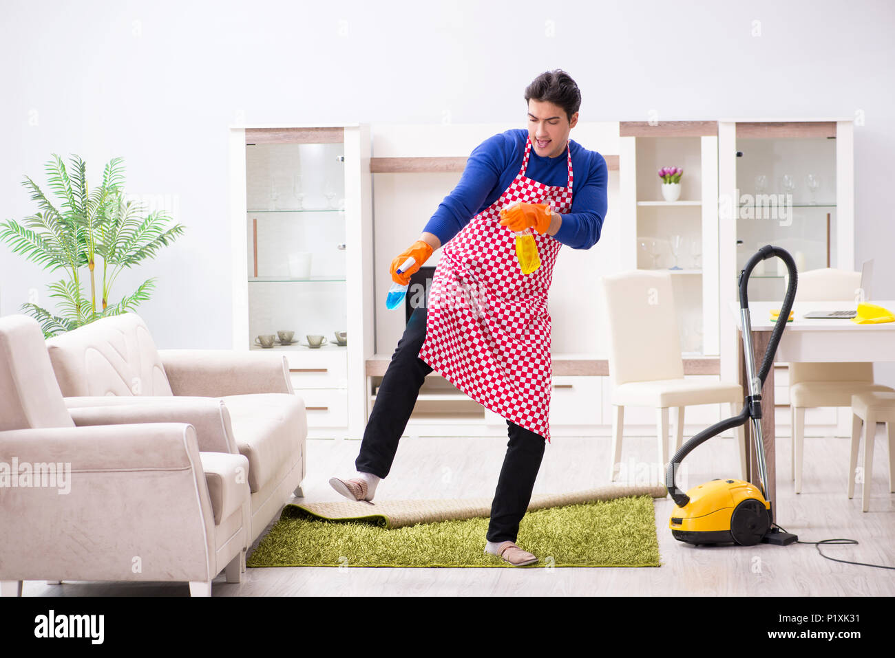 Contractor man cleaning house doing chores Stock Photo - Alamy