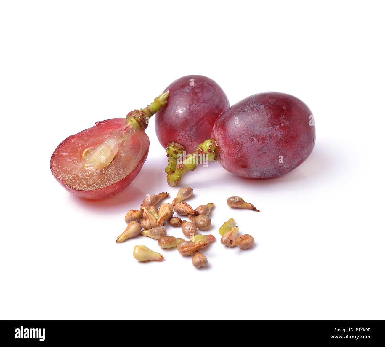 grape seeds on white background macro closeup Stock Photo - Alamy