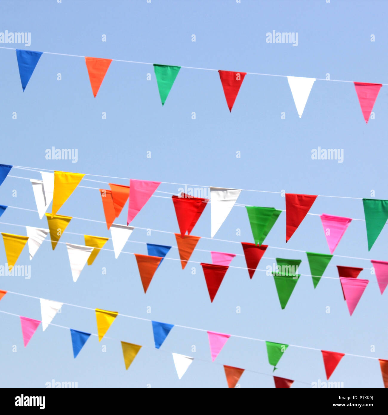 colorful triangle flag with beautiful sky background Stock Photo - Alamy