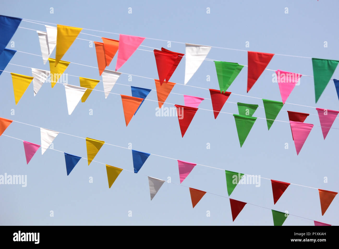 colorful triangle flag with beautiful sky background Stock Photo - Alamy