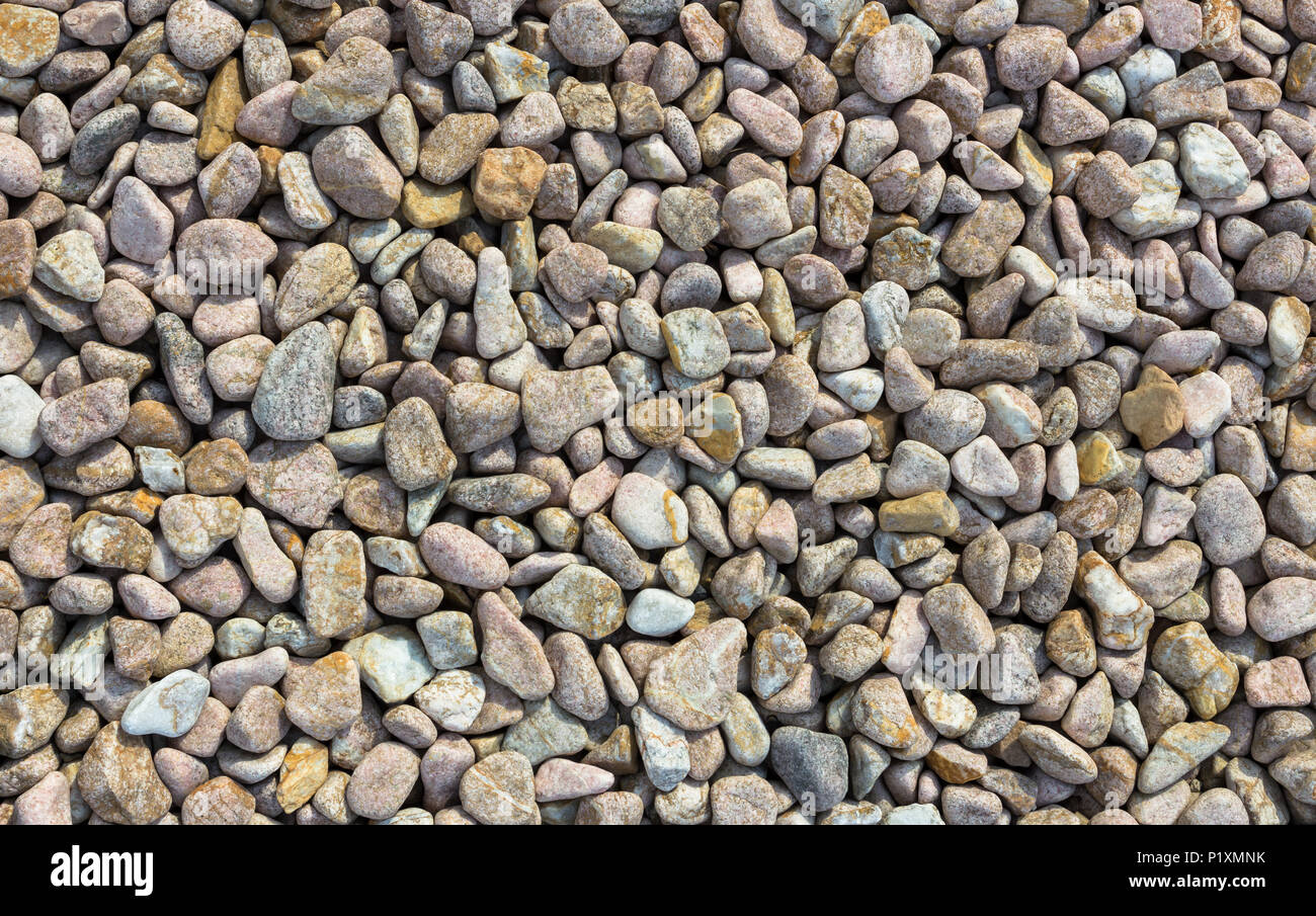 Abstract small stone background, texture stone. Pile of pastel colored ...