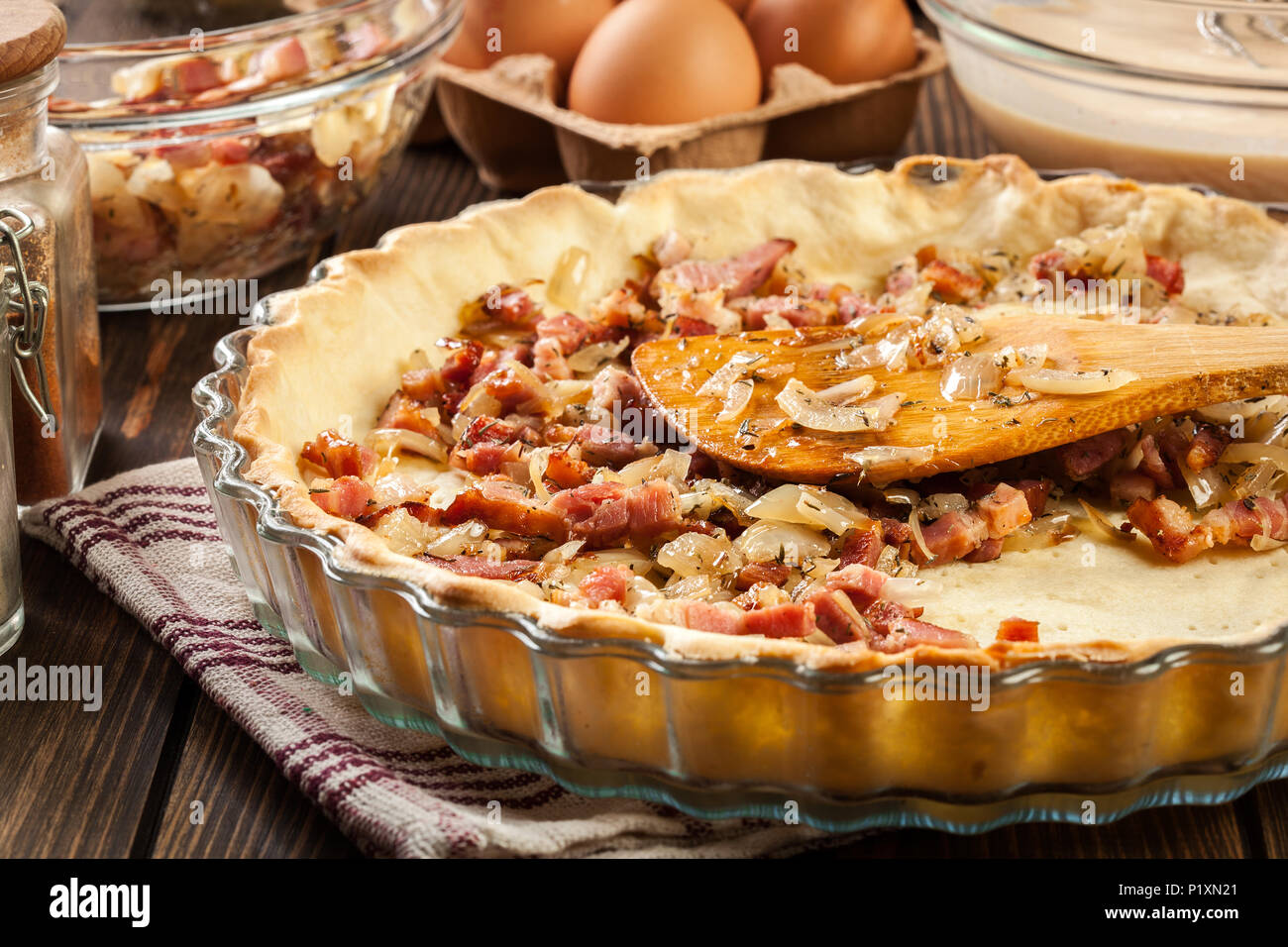 Making stuffing while preparing a traditional quiche. French cuisine ...