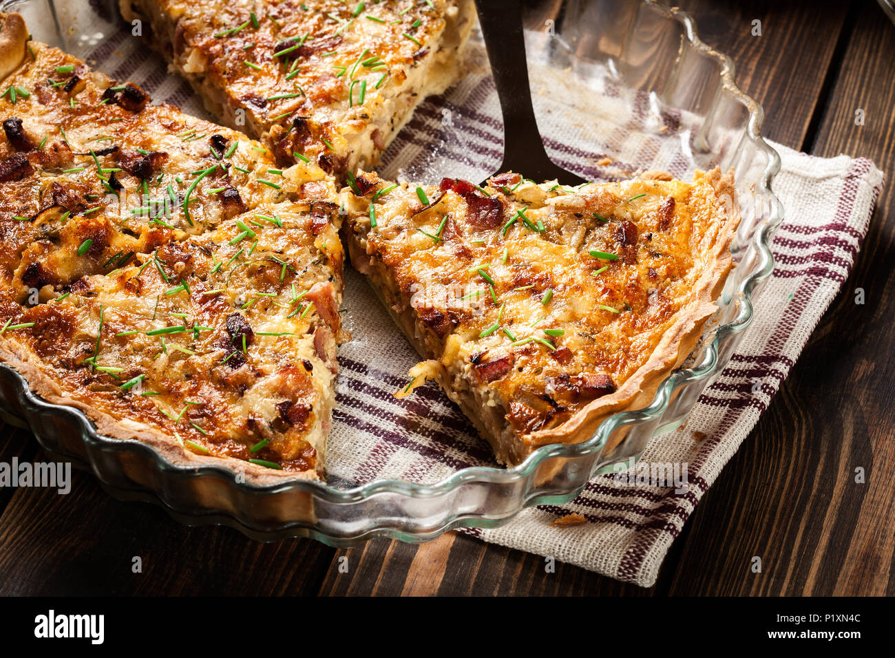 Pieces of quiche lorraine with bacon and cheese. French cuisine Stock ...