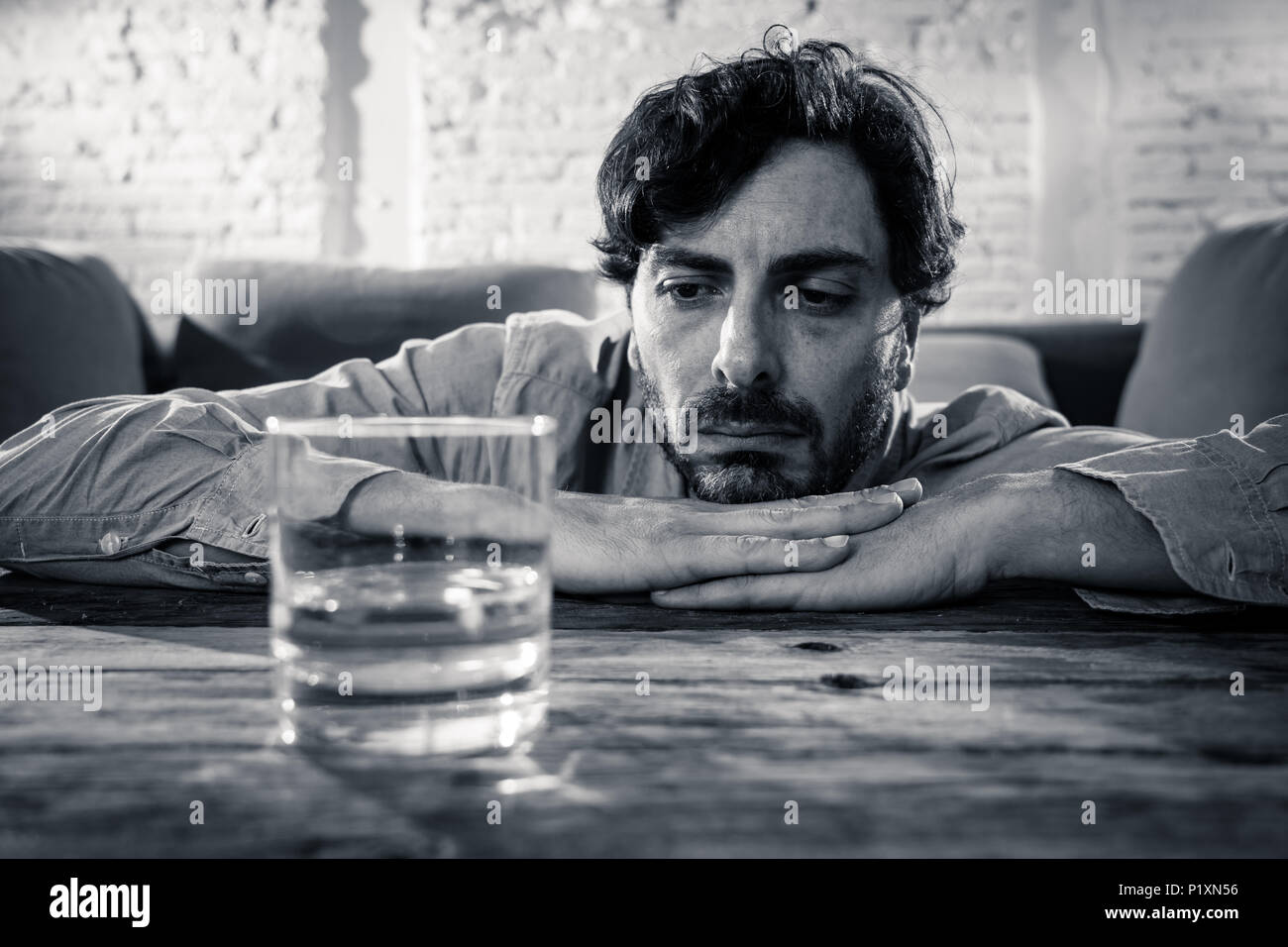 drunk alcoholic lain business man drinking whiskey from the bottle and ...