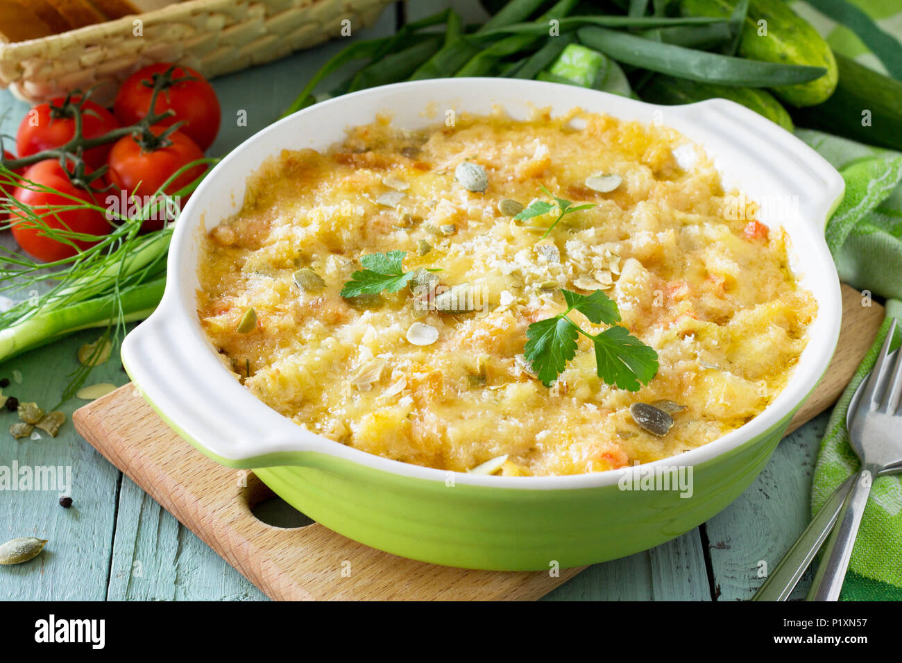 asserole crumble with red fish, white bread and cheese on the kitchen ...