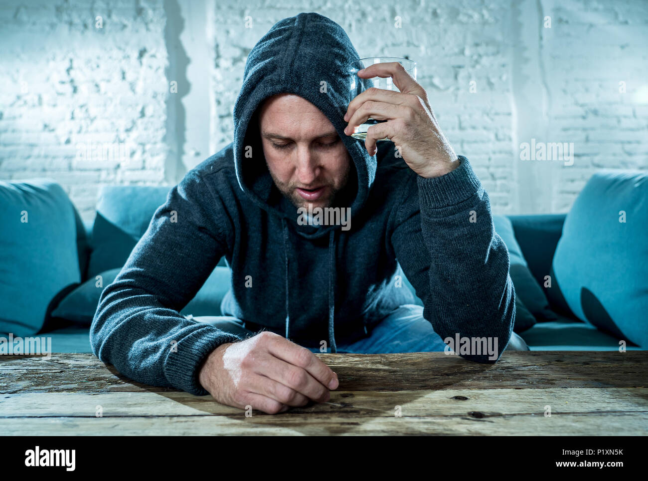 drunk alcoholic unemployed man drinking whiskey from the glass and ...