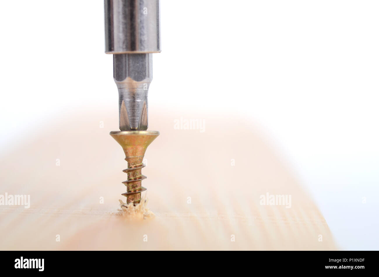 Wood Screw being screwed into a wood , Carpenter woodwork, screwing ...