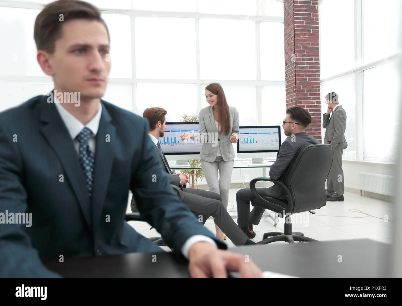 A male office worker browsing the computer for information Stock Photo ...