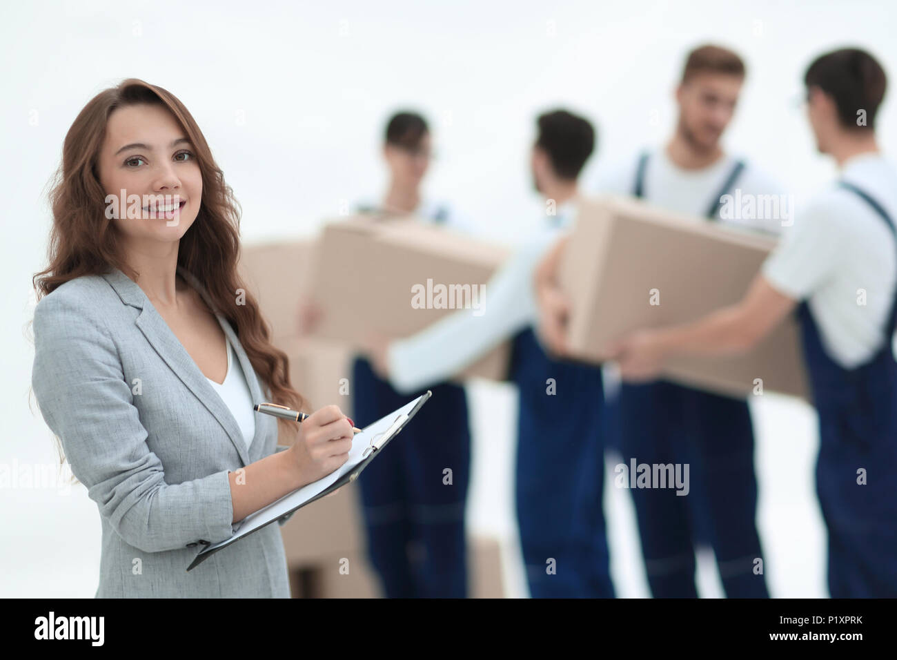 Businessman with documents, creating a stack of cardboard boxes Stock ...
