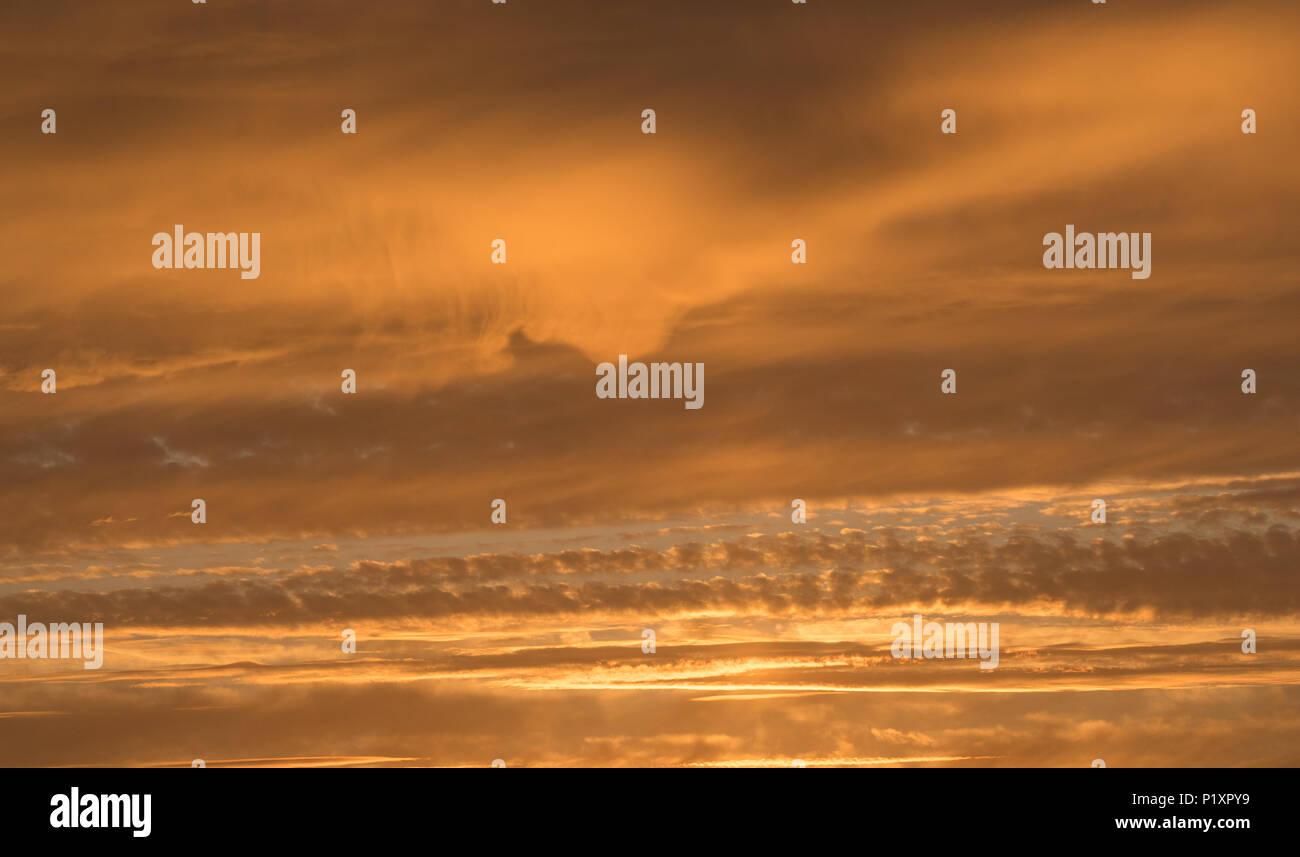 Red sky at sunset showing glow behind clouds, northern England Stock ...