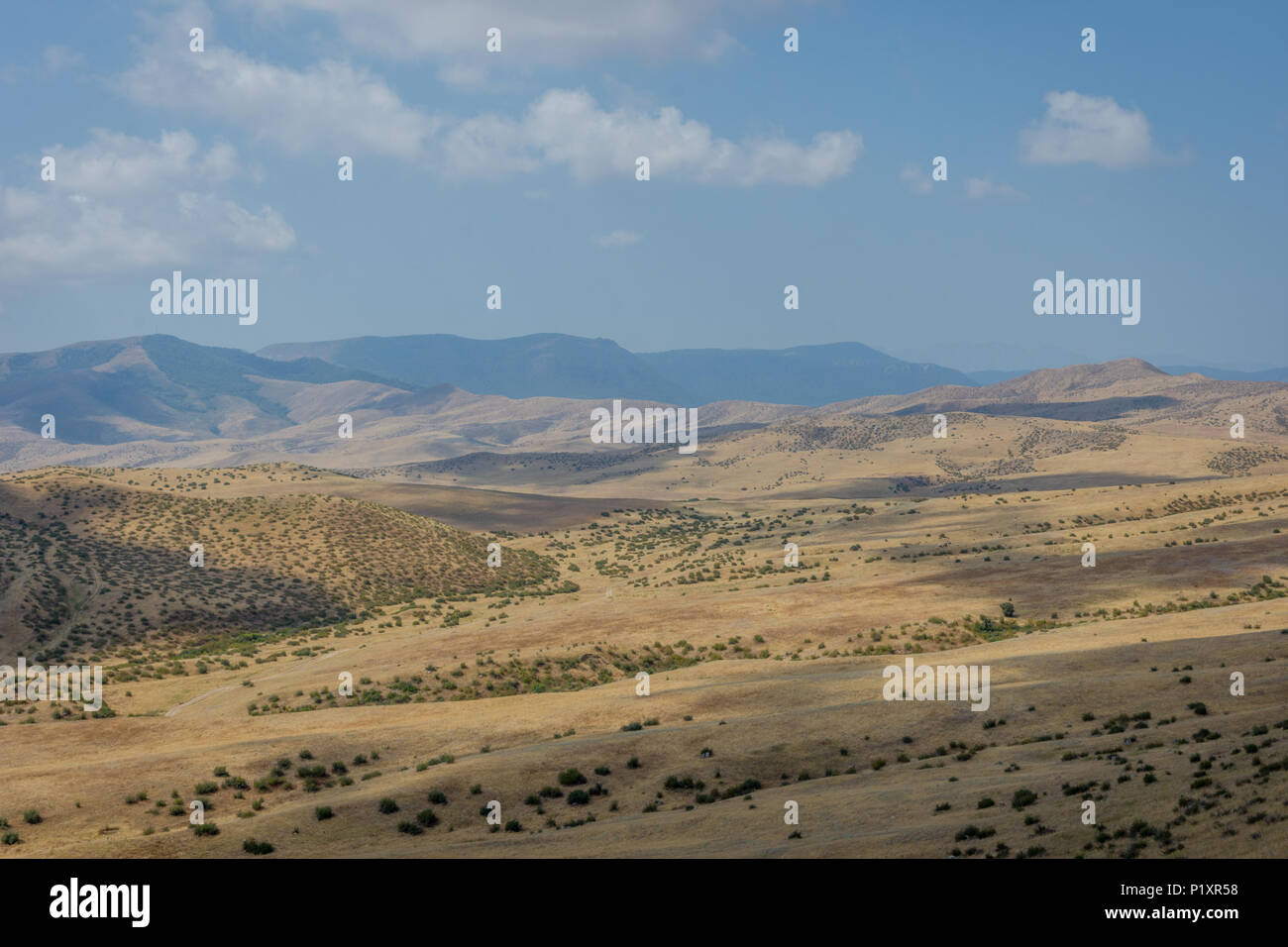 Golden summer landscape of hills and meadows around Tigranakert ...