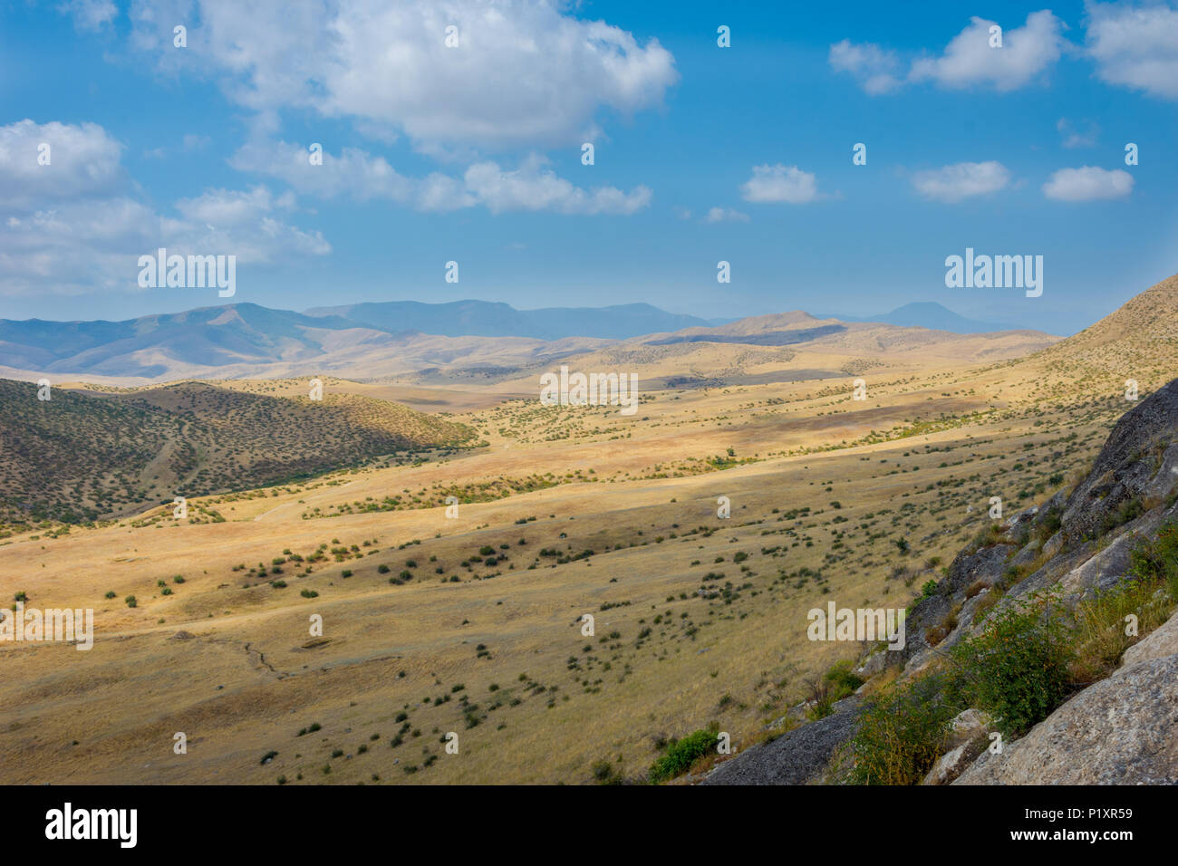 Golden summer landscape of hills and meadows around Tigranakert ...