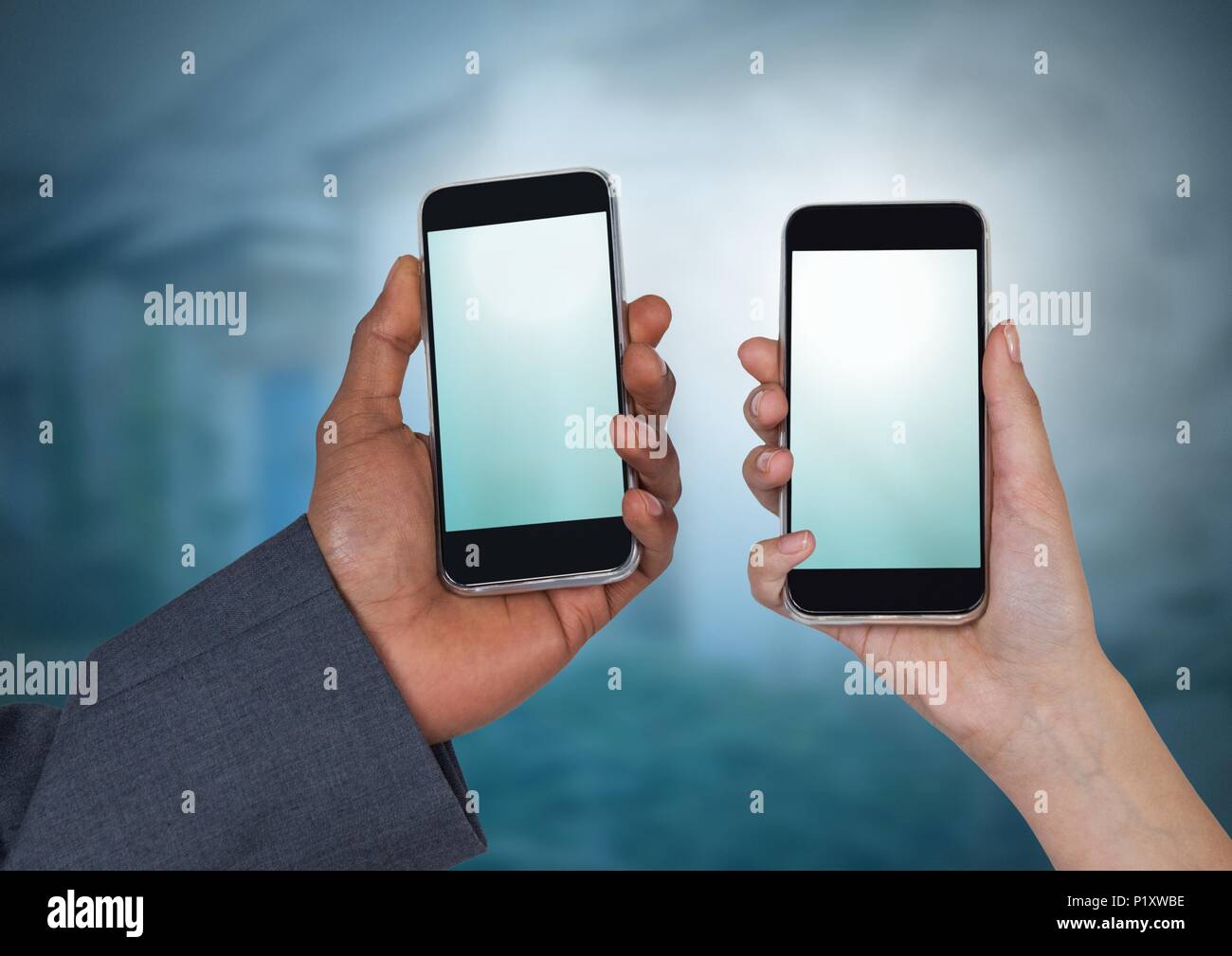phones in two hands illuminated Stock Photo - Alamy