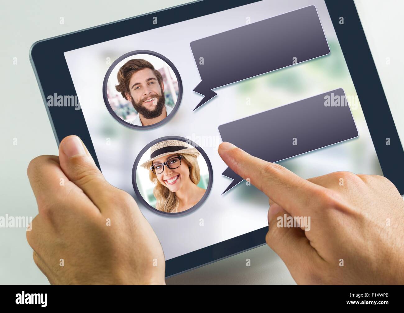 Hand using tablet with chat bubble messaging profile Stock Photo - Alamy