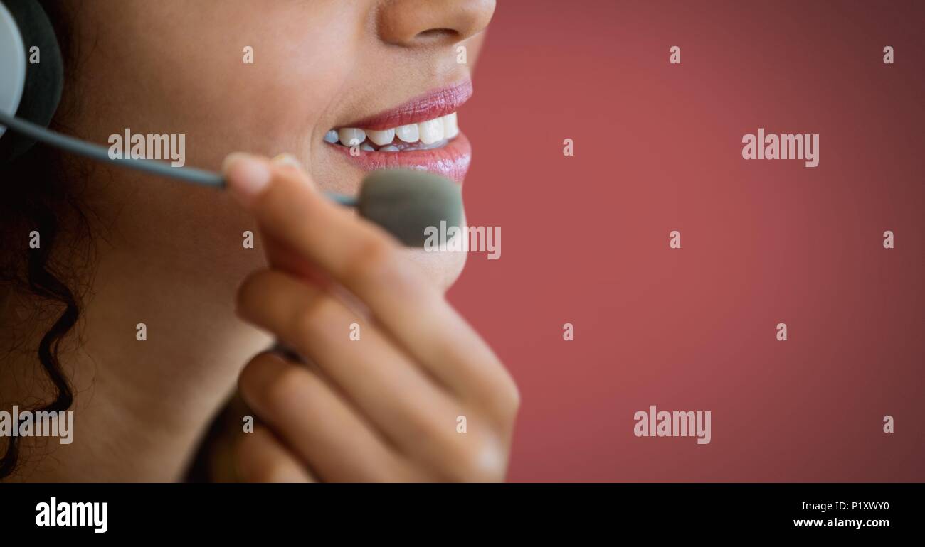 Call center Customer service woman with red background Stock Photo - Alamy
