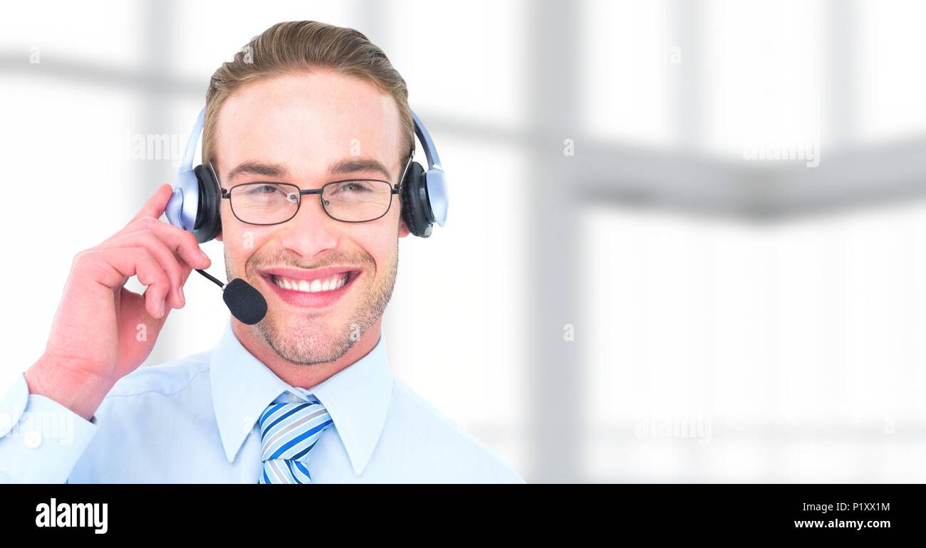 Customer service man with bright background in call center Stock Photo ...