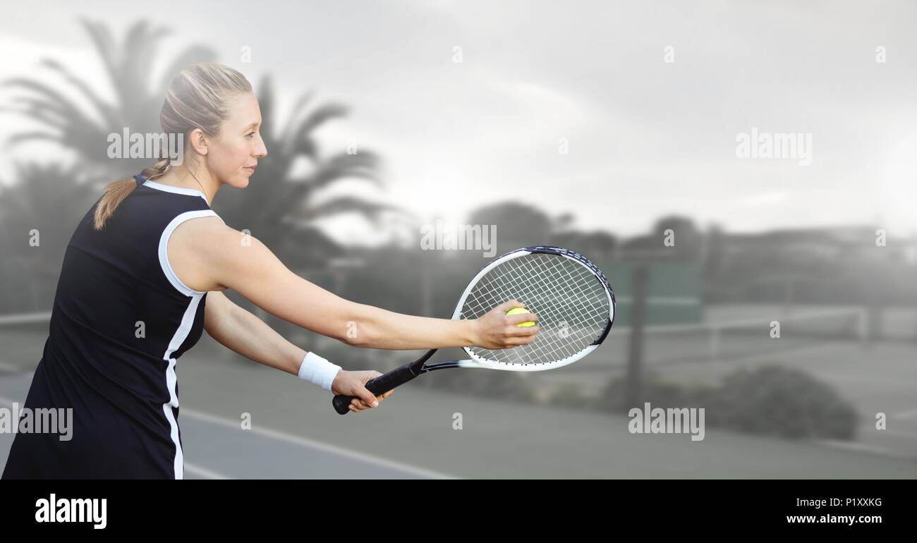 Tennis player woman with grey background with racket Stock Photo - Alamy