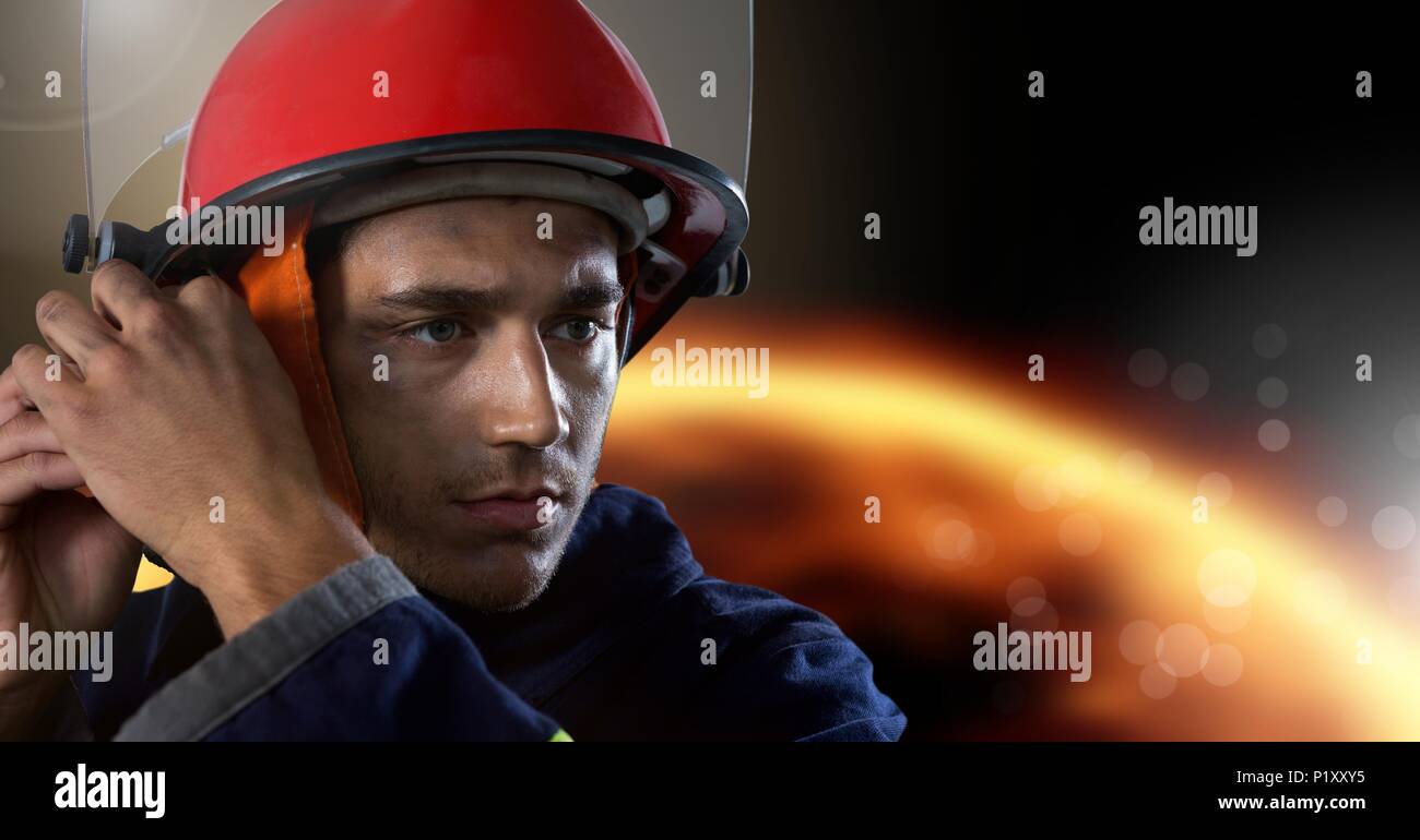 Firefighter in front of burning fire sphere Stock Photo - Alamy