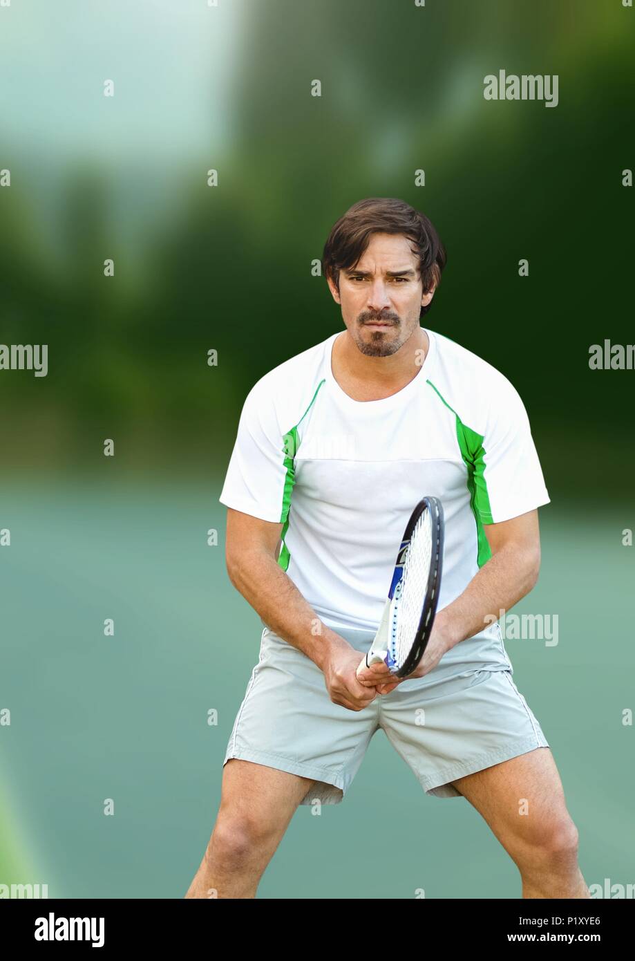 Tennis player man with green background with racket Stock Photo - Alamy
