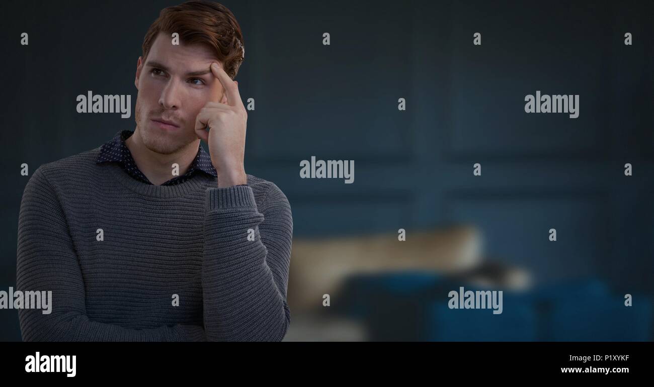 Businessman thinking with dark blue background Stock Photo - Alamy