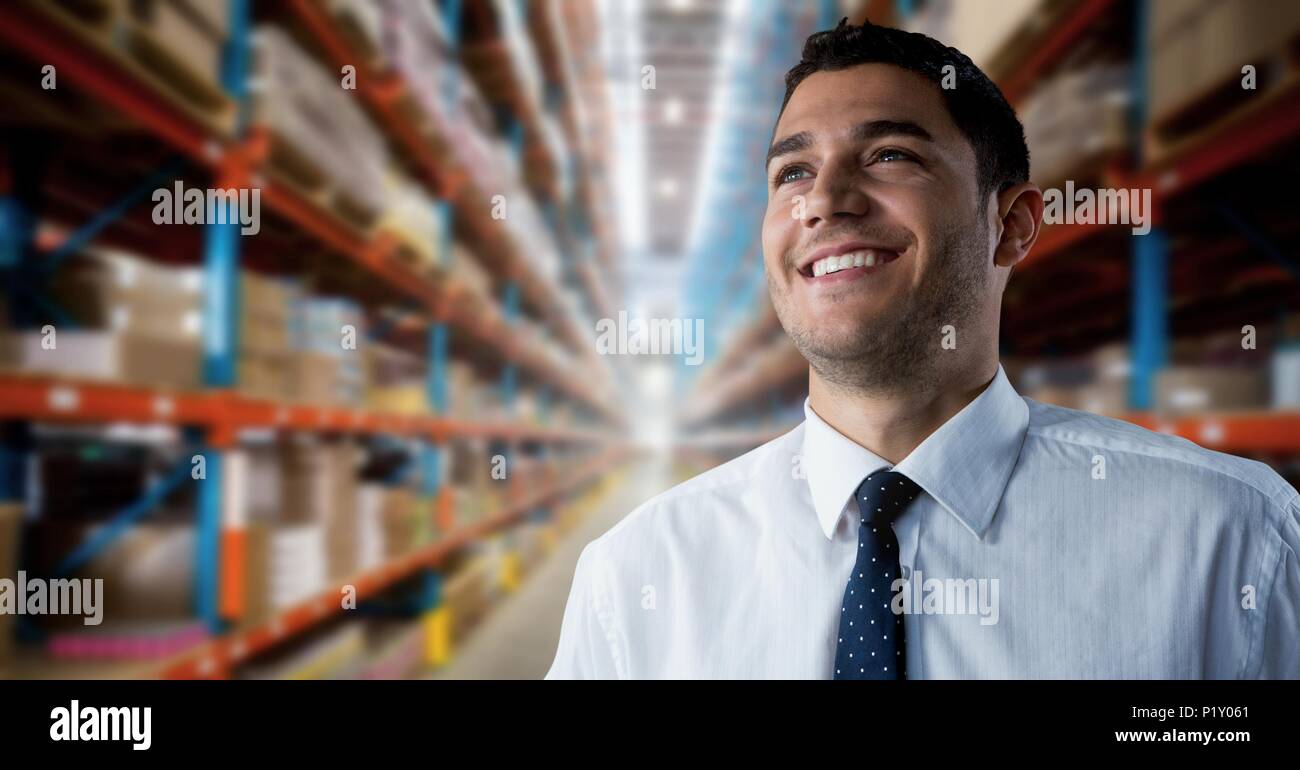 Businessman smiling successfully in warehouse perspective Stock Photo ...