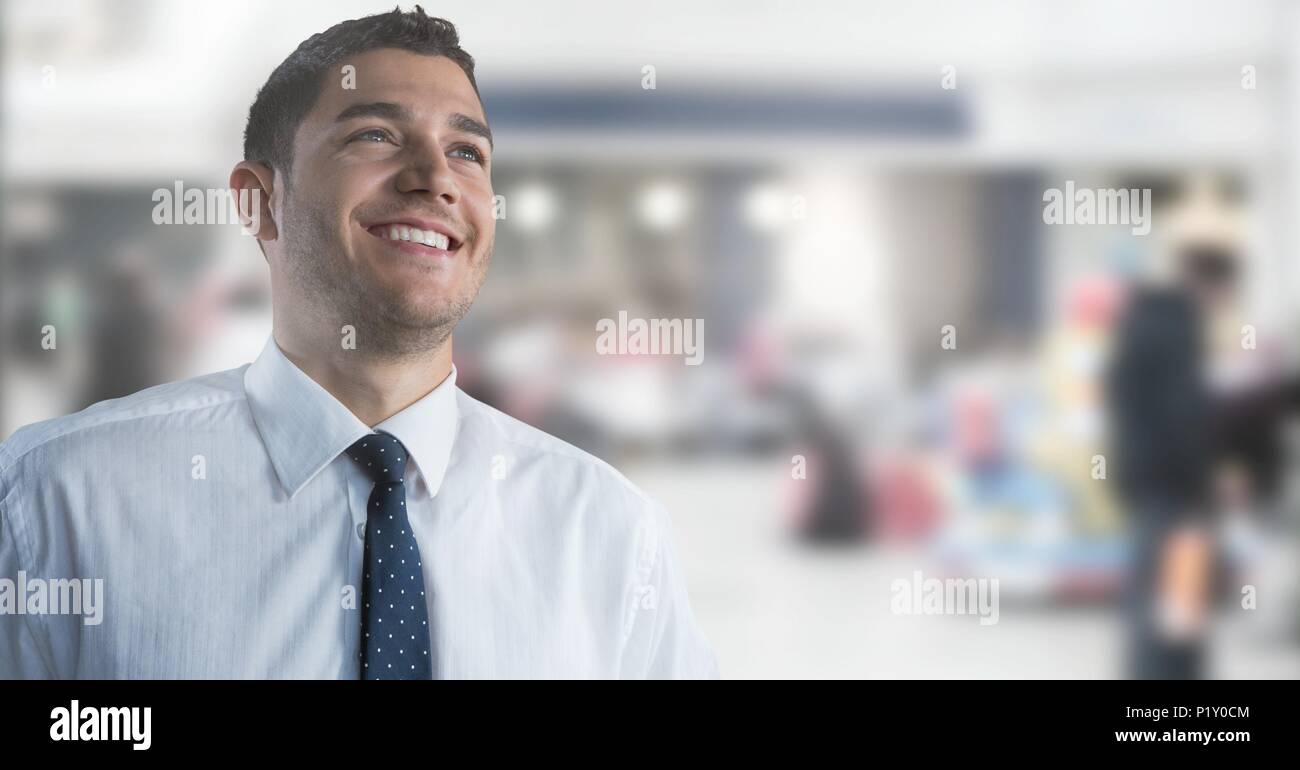 Businessman smiling in shopping mall center Stock Photo - Alamy