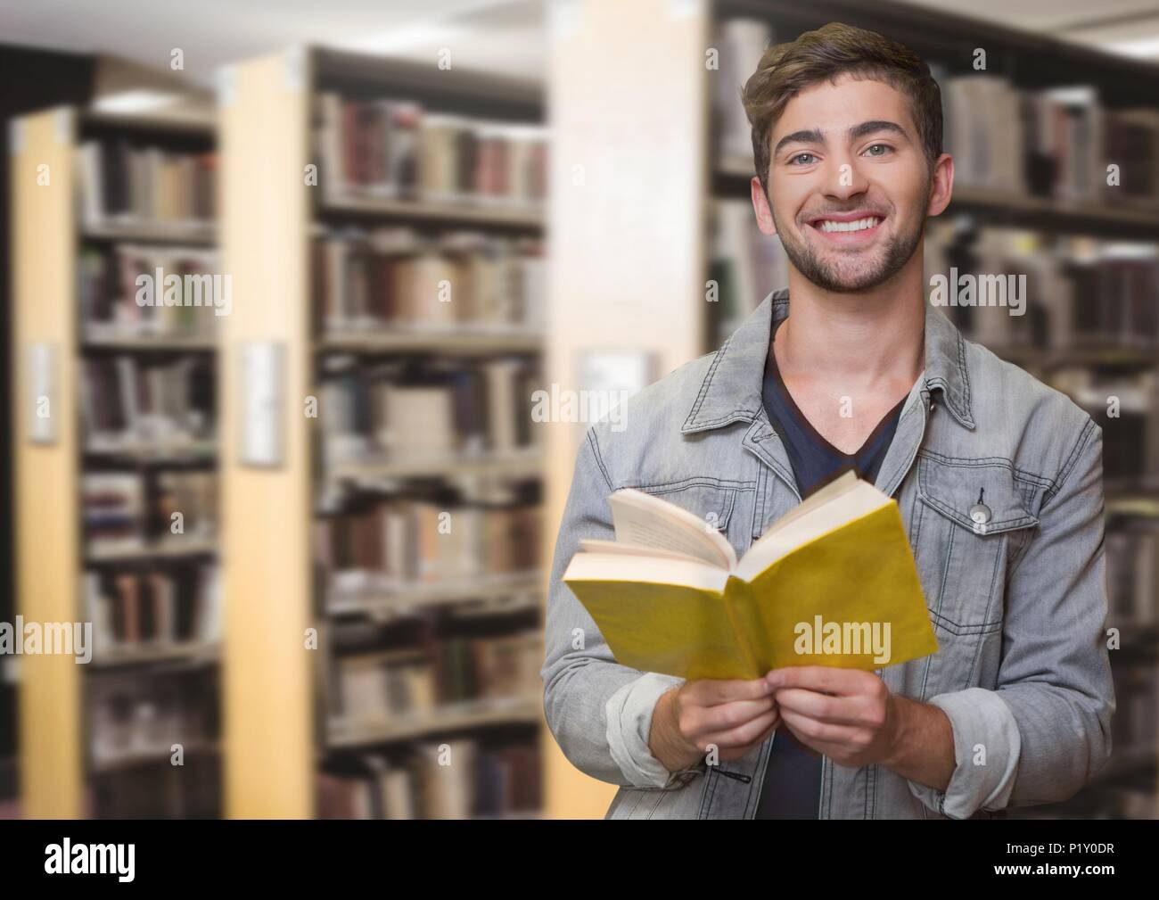 Student man in education library Stock Photo - Alamy